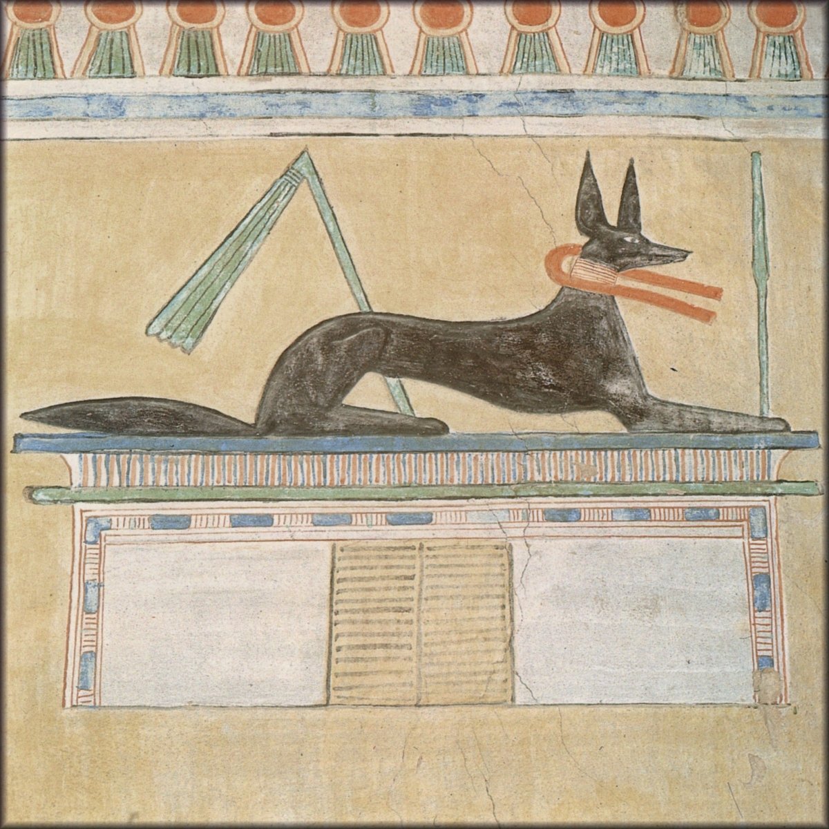 Anubis, Egyptian god of the dead lying on a sarcophogus c.2613-2494 BC